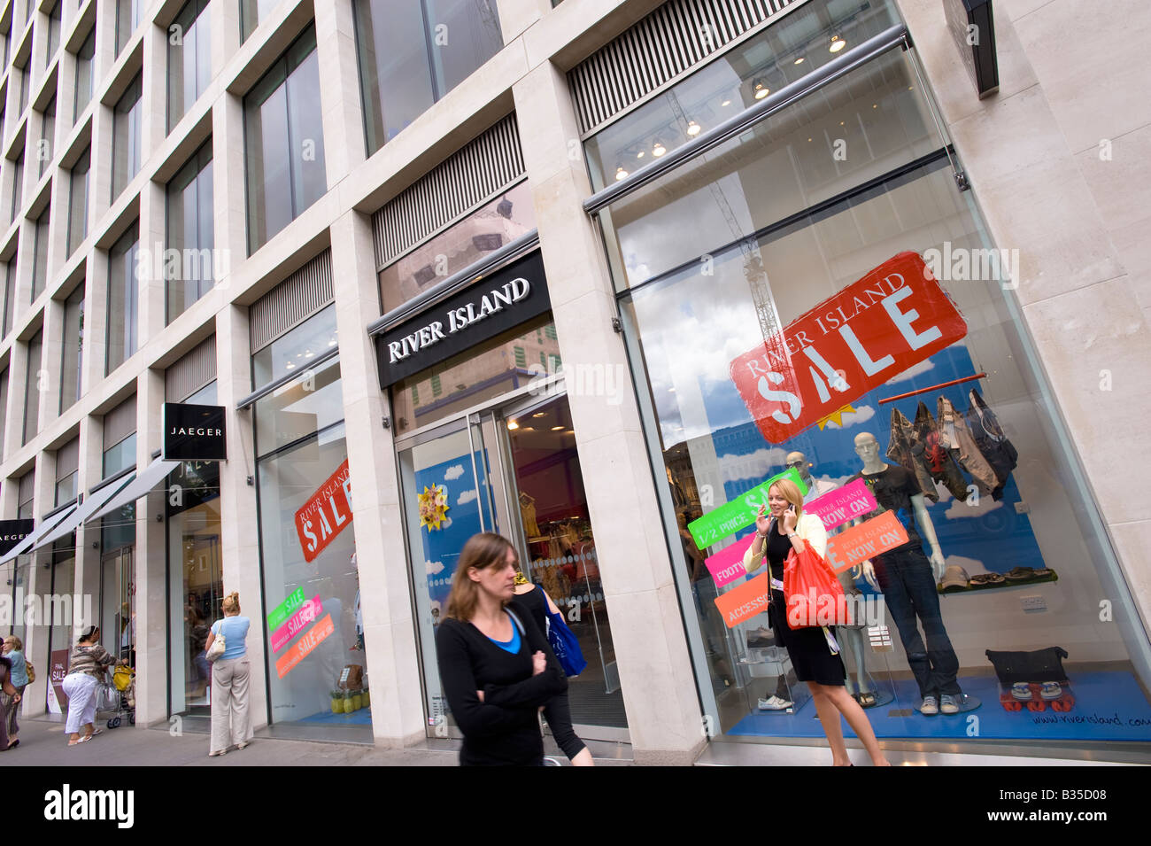 Sale sign in shop window, London, UK Stock Photo - Alamy