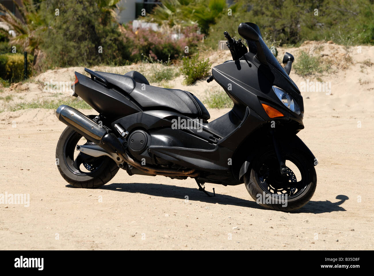 Big black scooter parked outdoors Stock Photo - Alamy