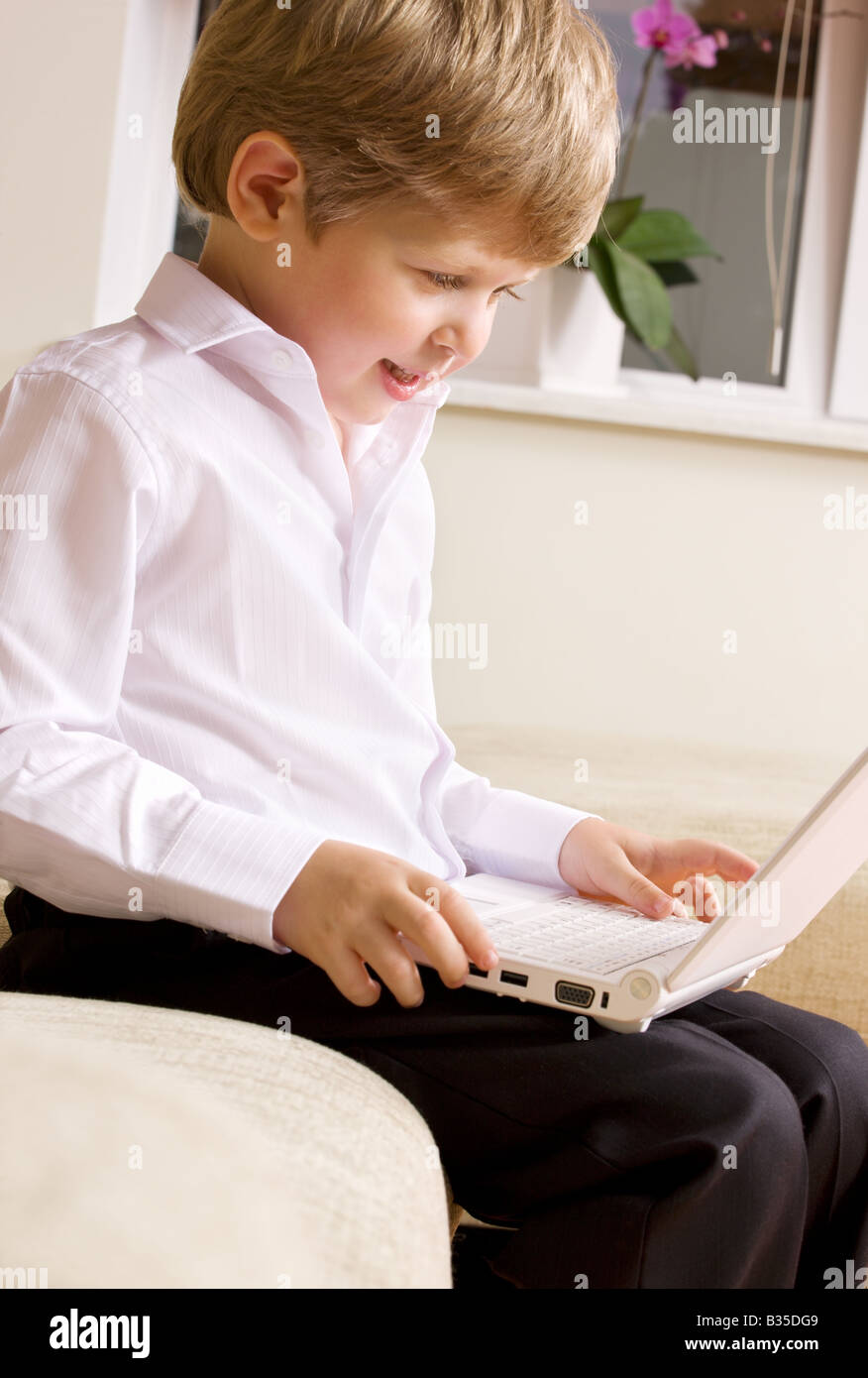 picture of happy boy with white laptop computer Stock Photo - Alamy