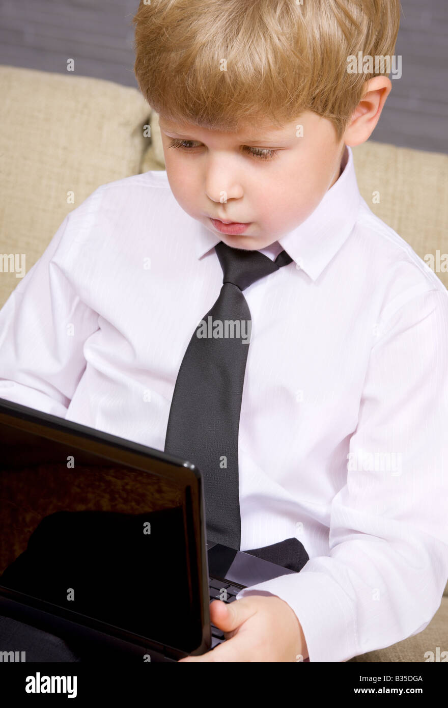 picture of boy with black laptop computer Stock Photo - Alamy