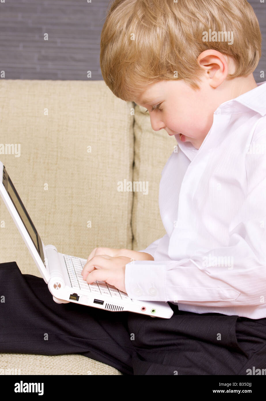picture of happy boy with white laptop computer Stock Photo - Alamy