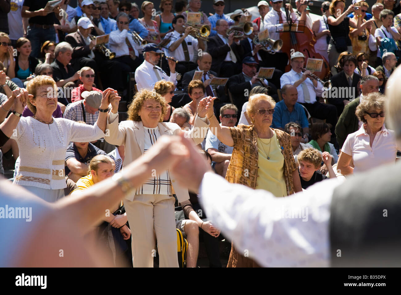 SPAIN Barcelona Dancers hold hands in Sardana dance in Cathedral plaza ...