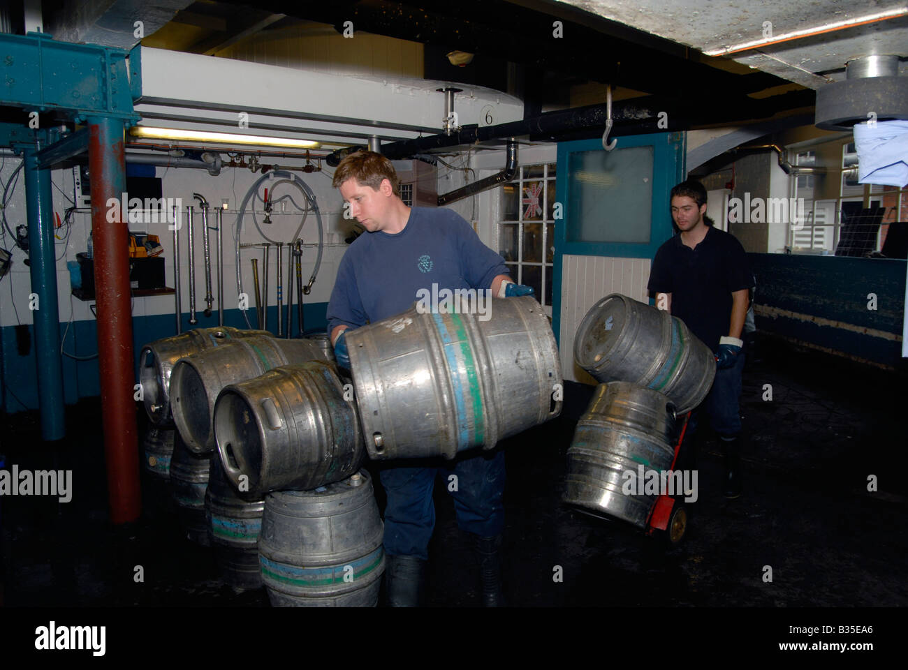 Beer poured into casks at Harveys Brewery, a family owned business ...
