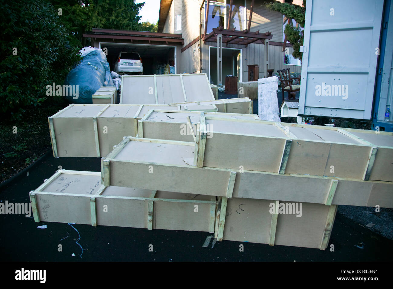 Unpacking large crates Stock Photo - Alamy