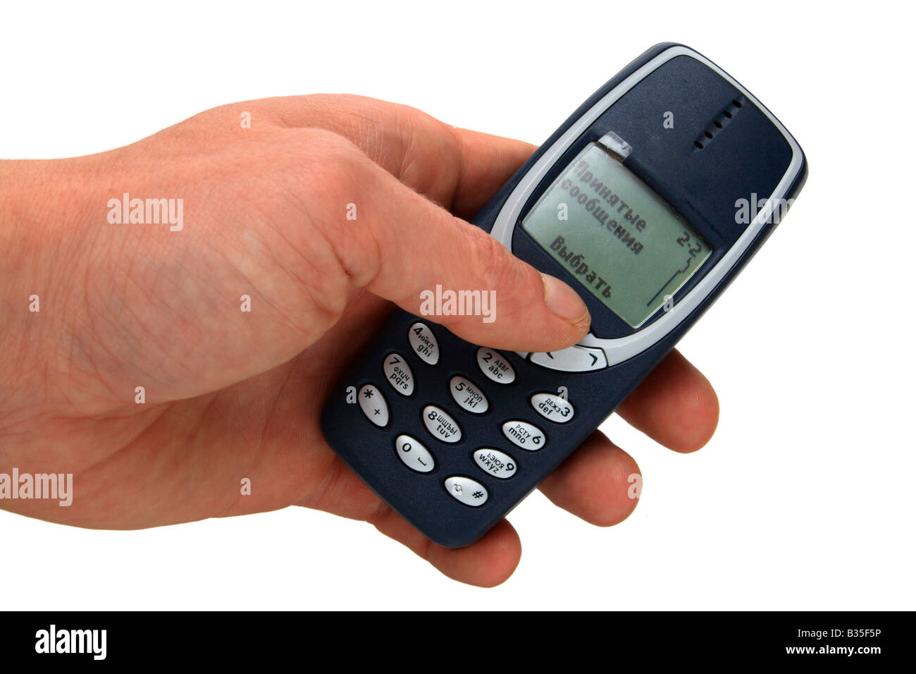 mobile telephone in hand isolated Stock Photo - Alamy