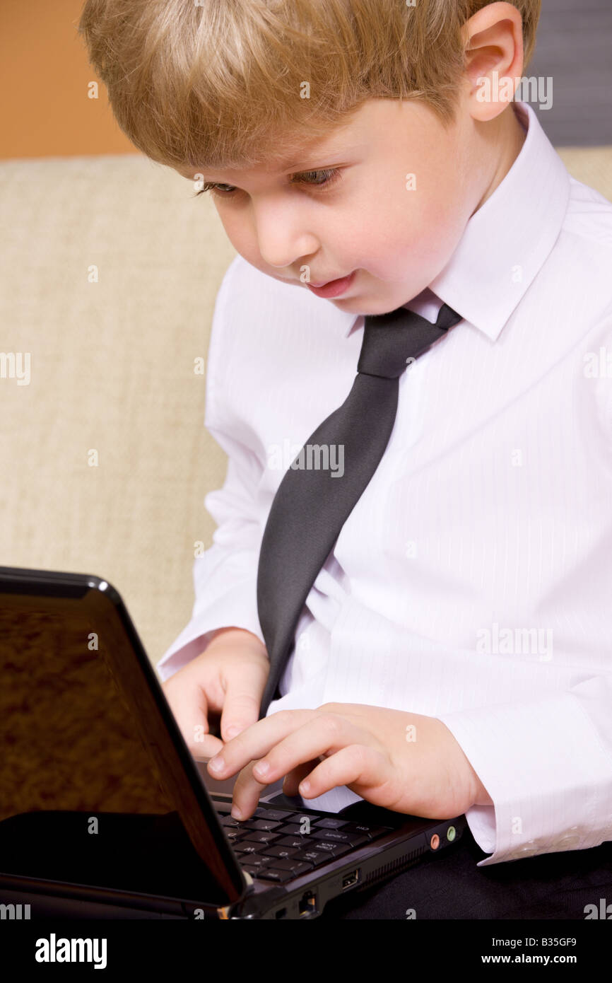 picture of happy boy with black laptop computer Stock Photo - Alamy