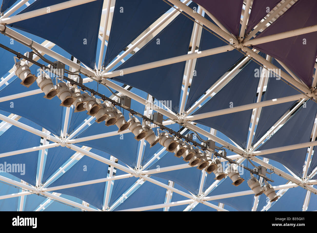 A large group of stage lights on top of a downtown performance center ...