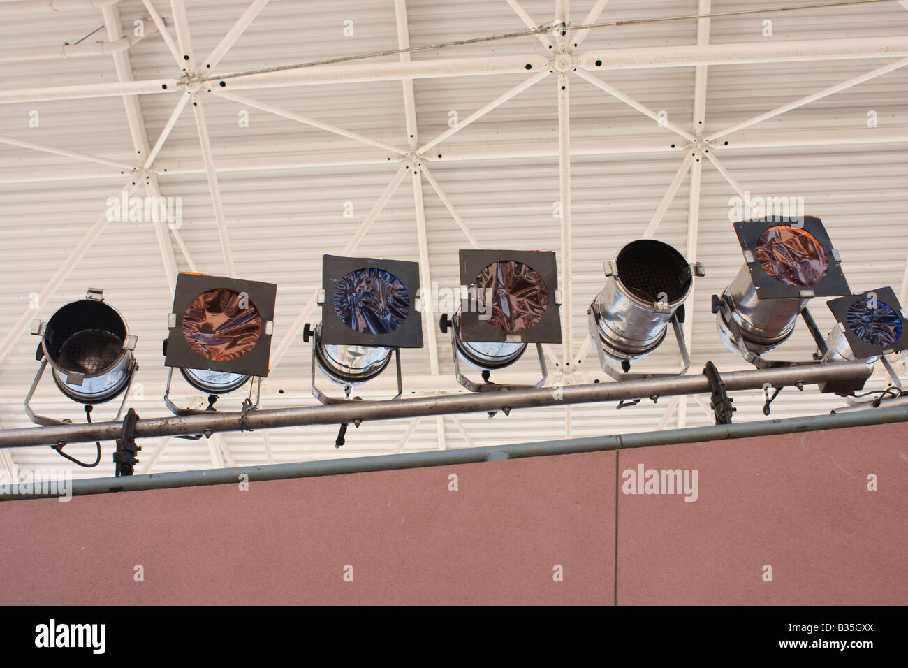A large group of stage lights on top of a downtown performance center ...