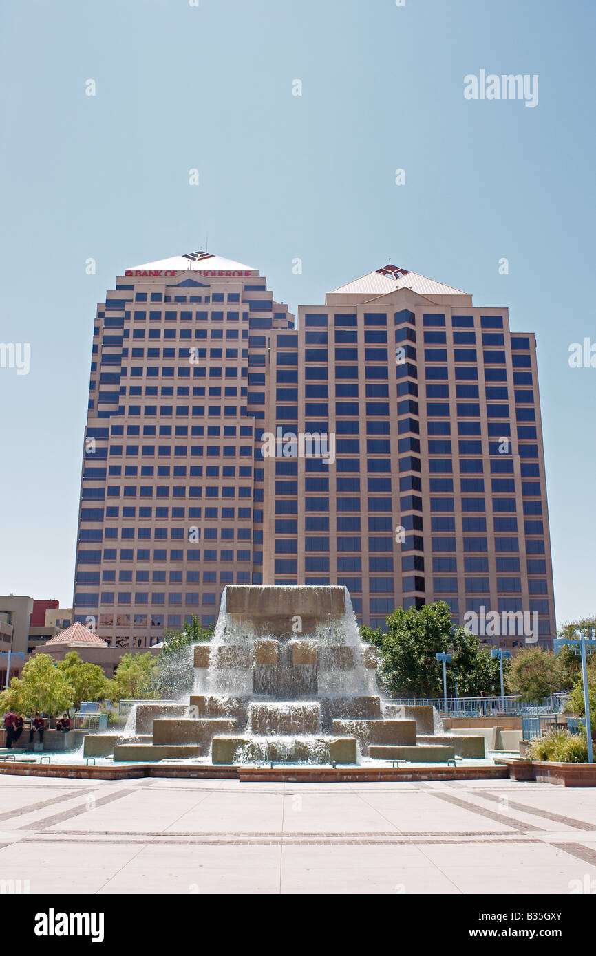 A dramatic view of two skyscrapers in Albuquerque from the civic plaza ...