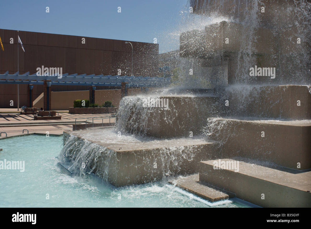 A sparkling fountain in a downtown plaza Stock Photo - Alamy