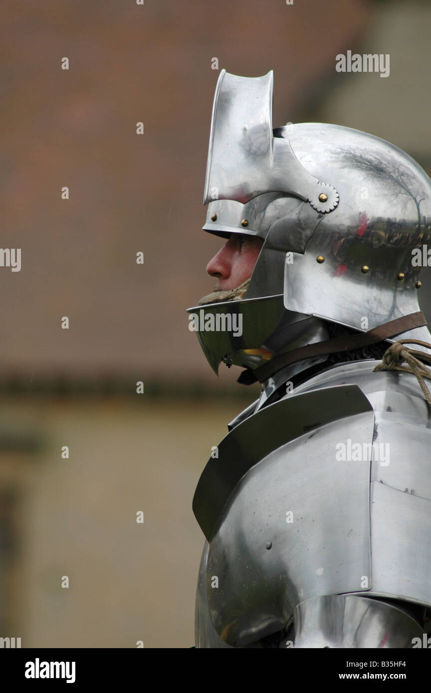 Knight in armour and helmet Stock Photo - Alamy