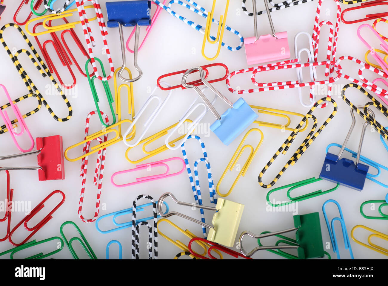 Coloured and patterned stationery sprawled on a white surface Stock ...
