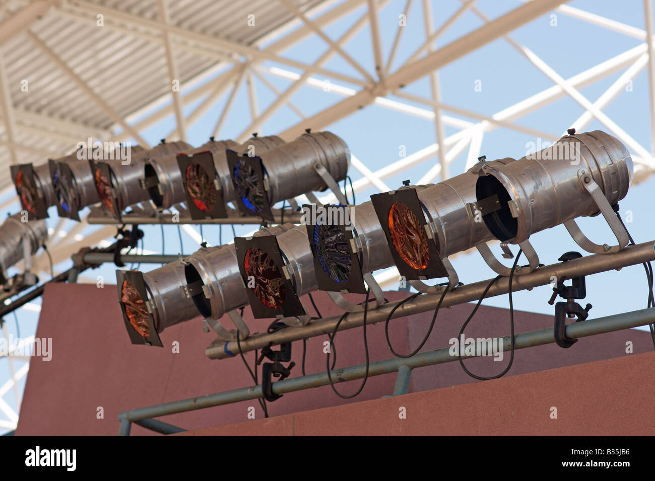 A large group of stage lights on top of a downtown performance center ...