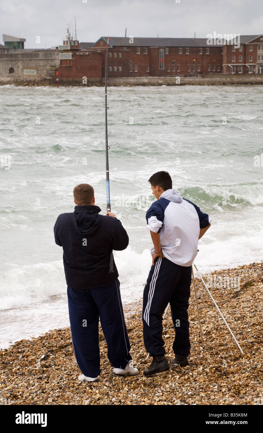 Two anglers fishing from the shoreline hi-res stock photography and ...