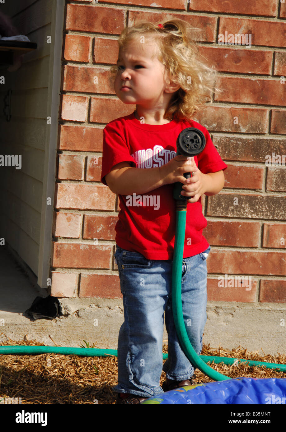 Hose pipe child hi-res stock photography and images - Alamy