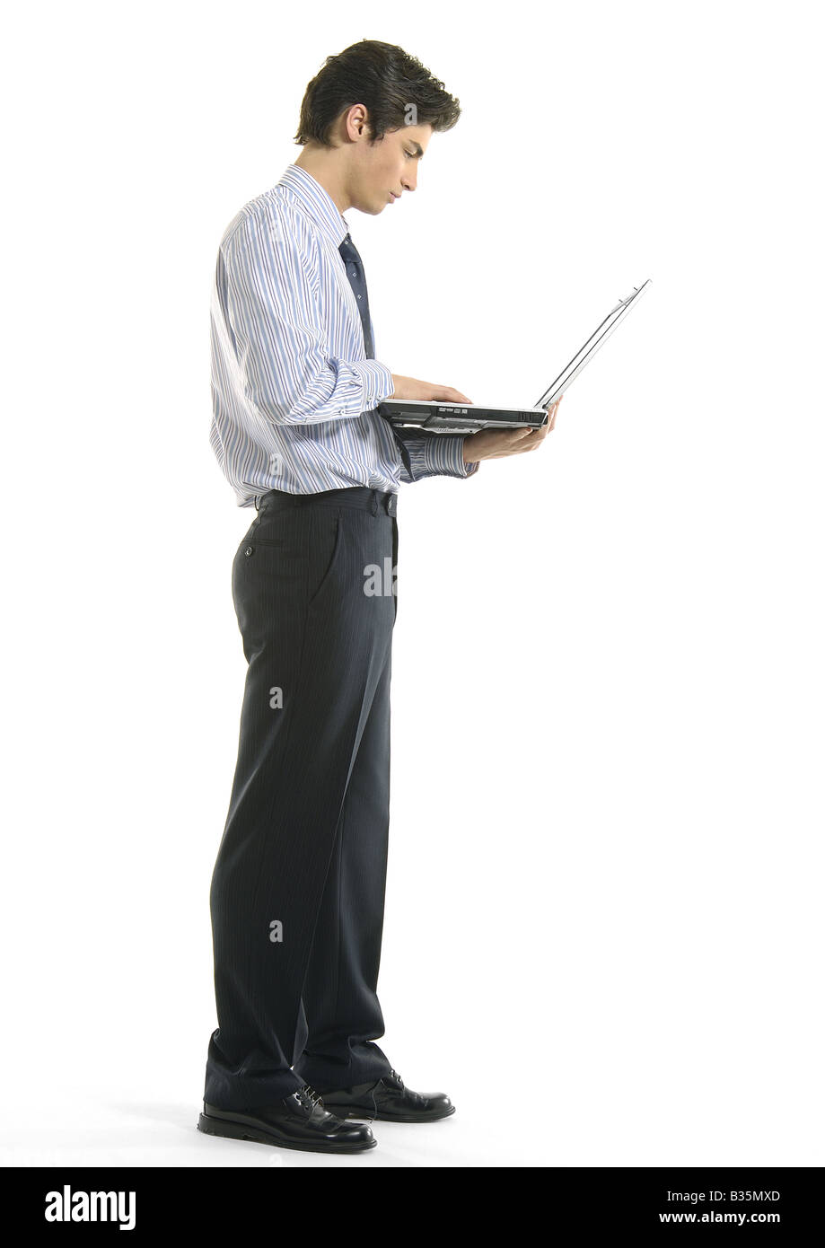 Side profile of a businessman using a laptop Stock Photo - Alamy