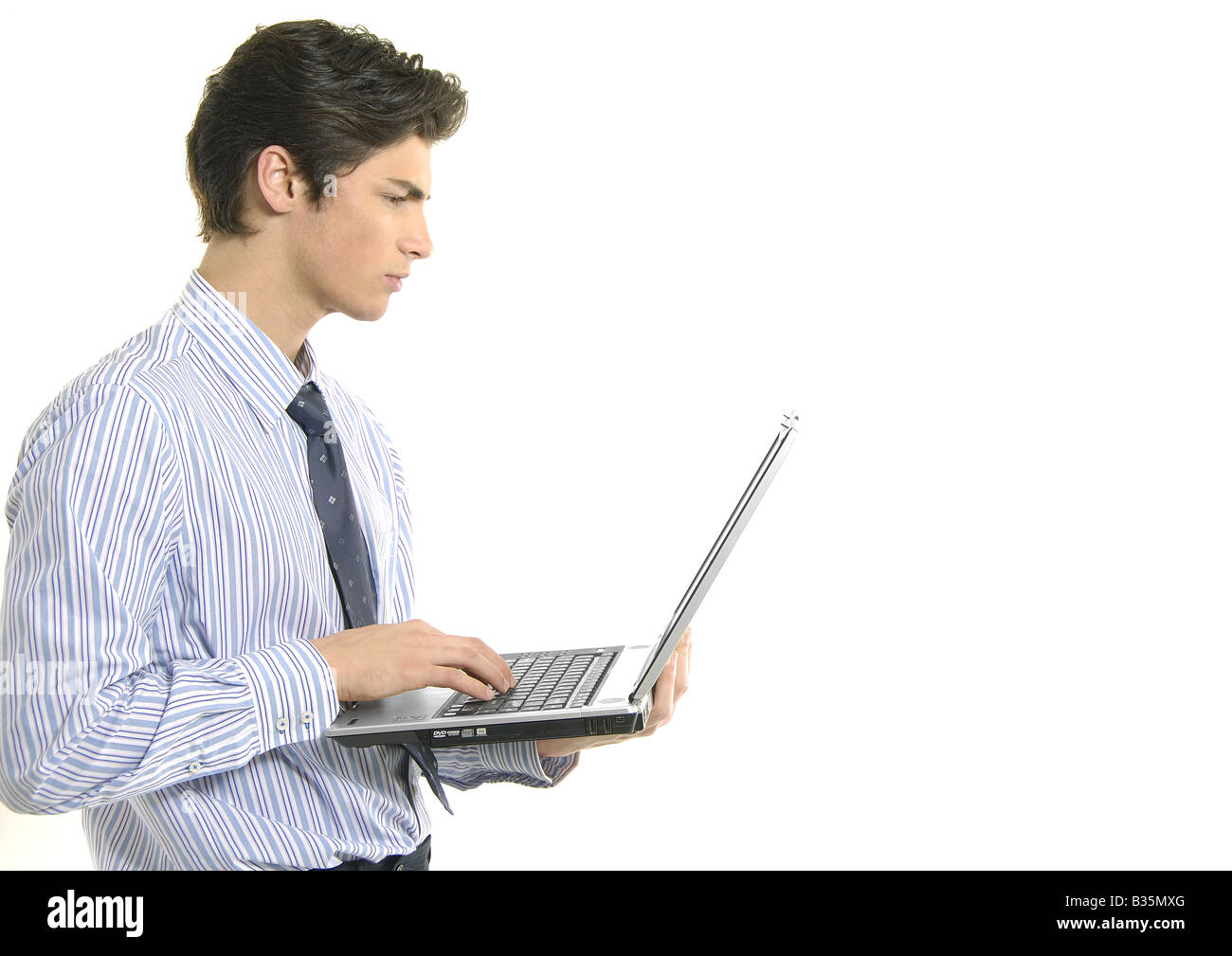 Side profile of a businessman using a laptop Stock Photo - Alamy