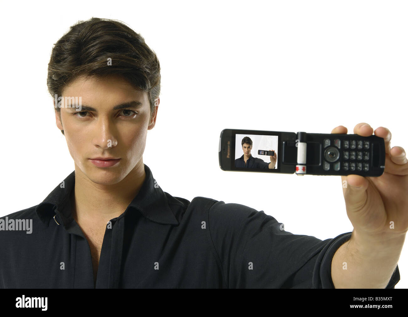 Portrait of a young man showing a mobile phone Stock Photo - Alamy