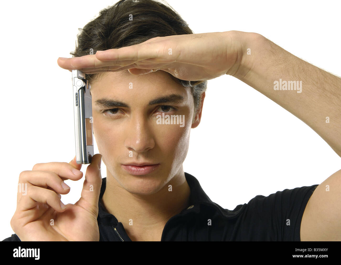 Portrait of a young man showing a mobile phone Stock Photo - Alamy