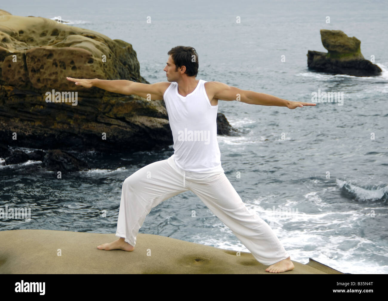 Young man practicing yoga Stock Photo - Alamy