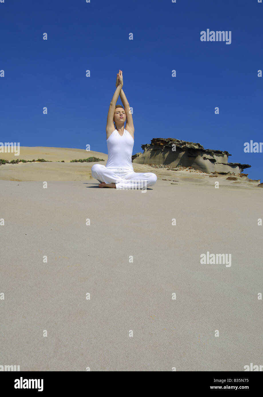 Young woman practicing yoga in a prayer position Stock Photo - Alamy