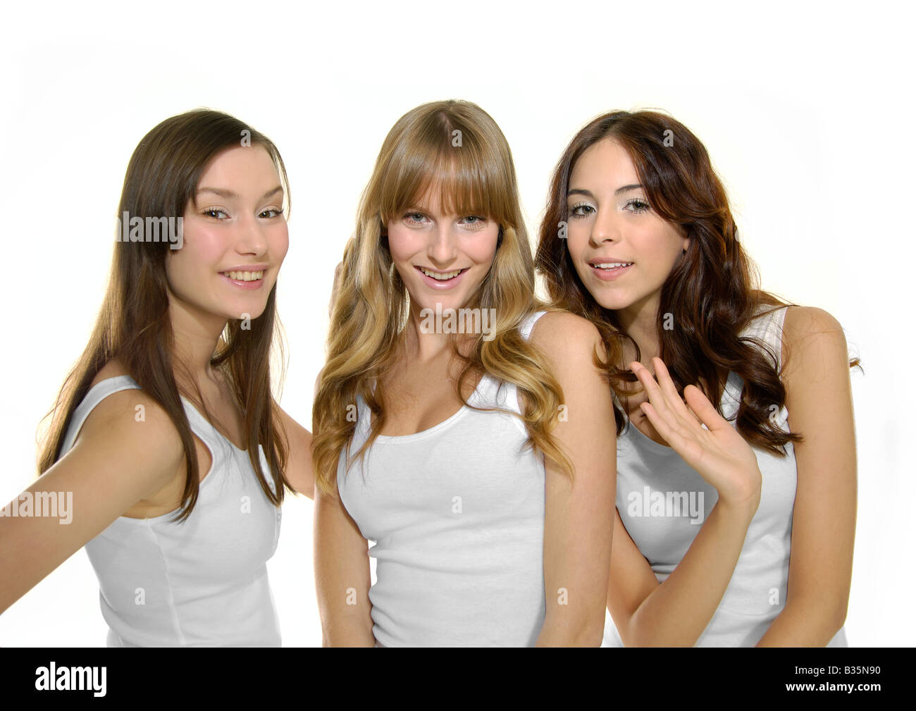 Portrait of three young women smiling Stock Photo - Alamy