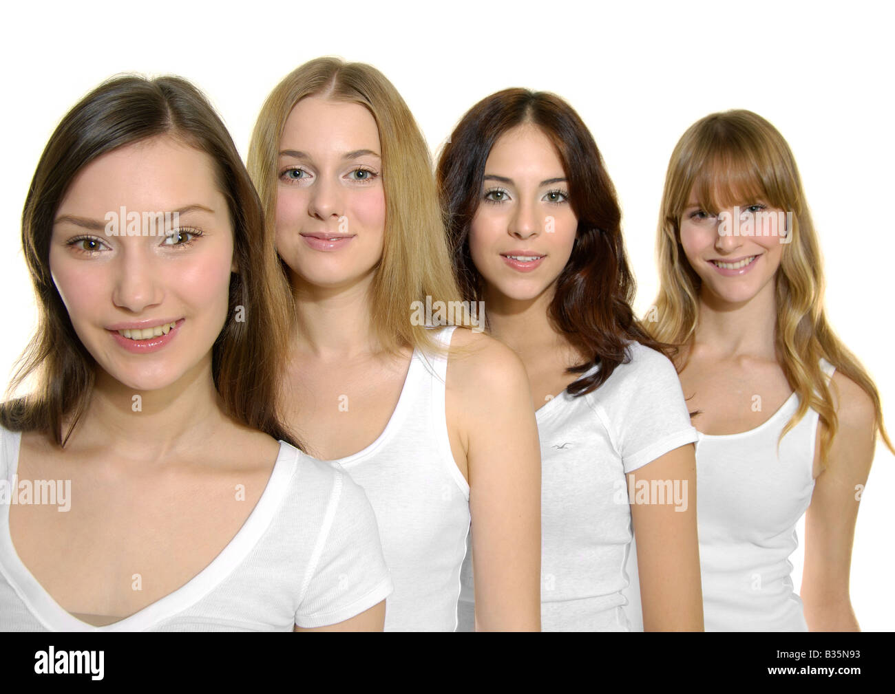 Portrait of four young women smiling Stock Photo - Alamy