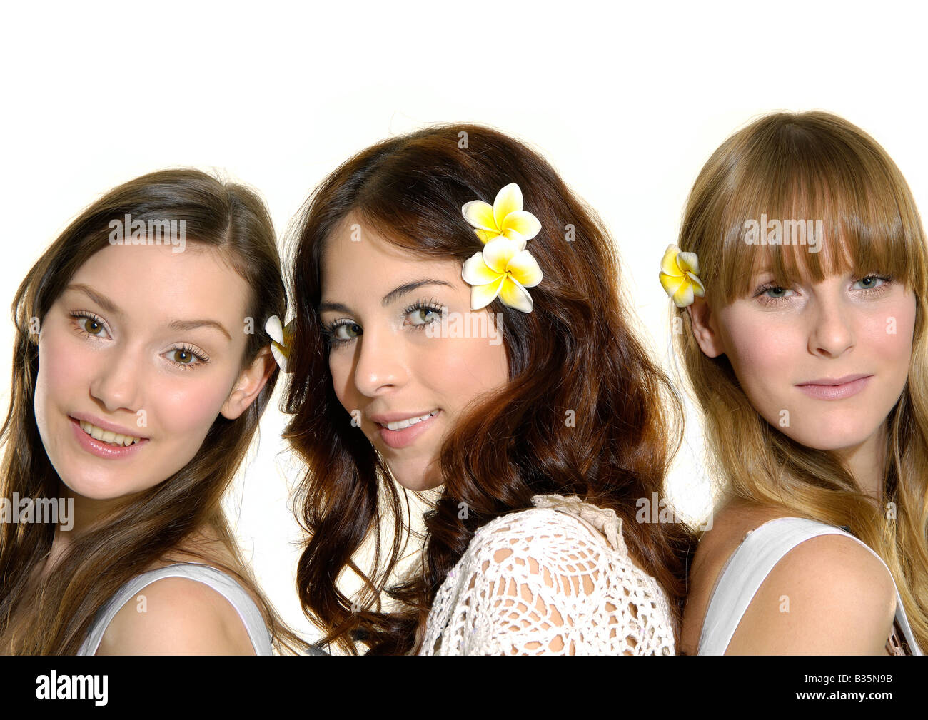 Portrait of three young women smiling Stock Photo - Alamy