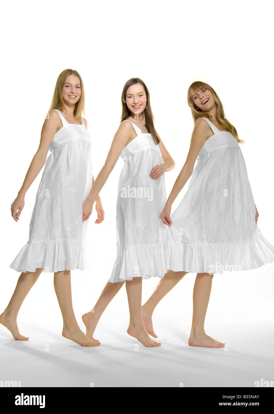 Portrait of three young women dancing Stock Photo - Alamy