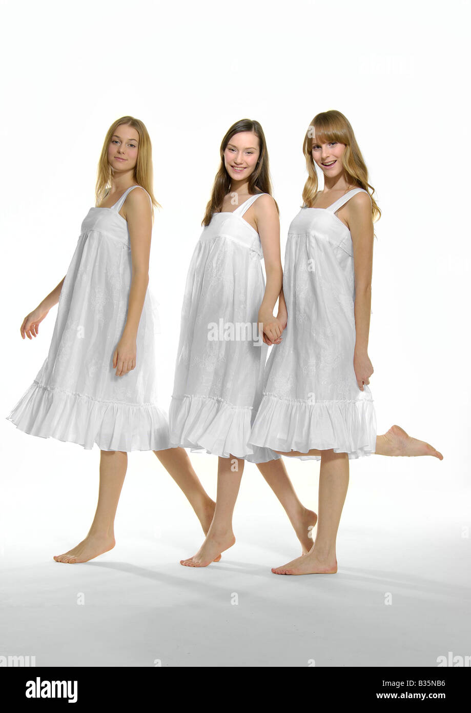 Portrait of three young women standing together Stock Photo - Alamy