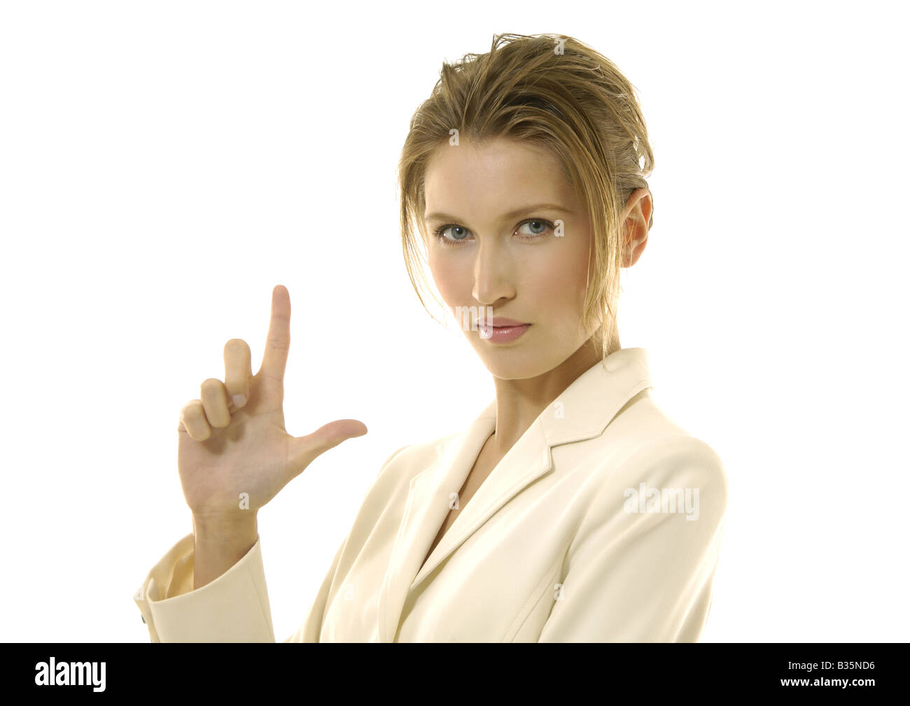 Portrait of a businesswoman making a gun sign Stock Photo - Alamy