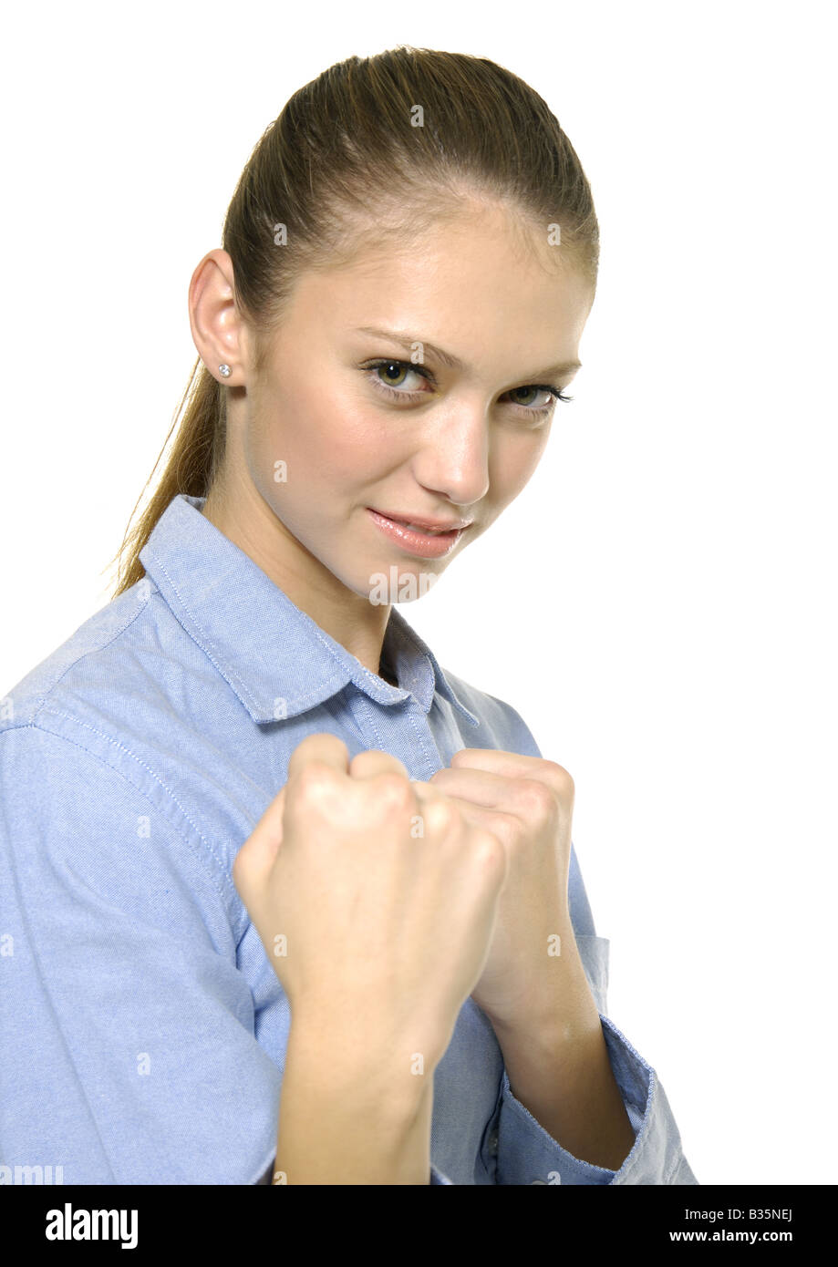 Portrait of a young woman making fist Stock Photo - Alamy