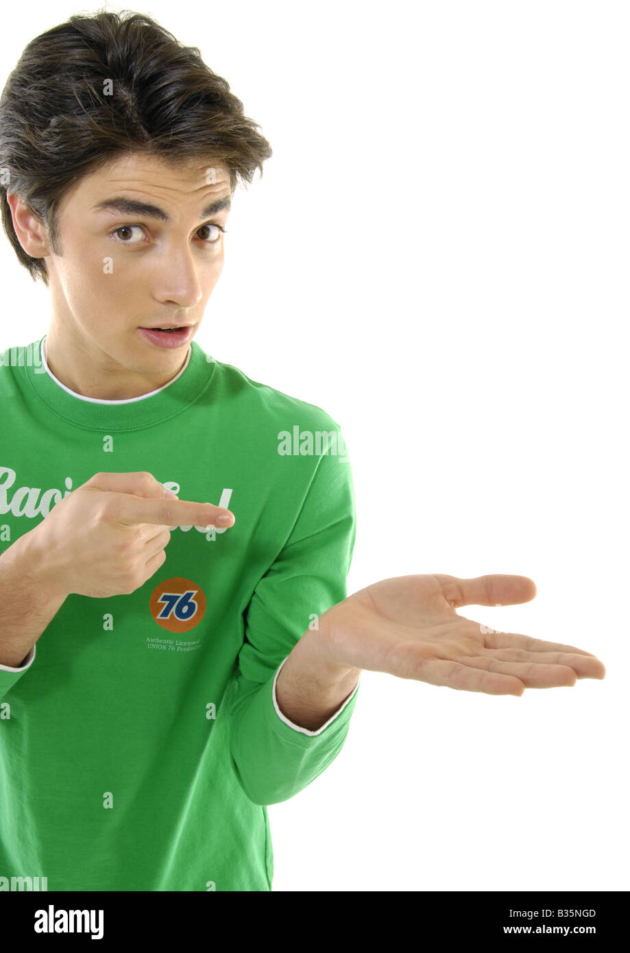 Portrait of a young man pointing towards his palm Stock Photo - Alamy