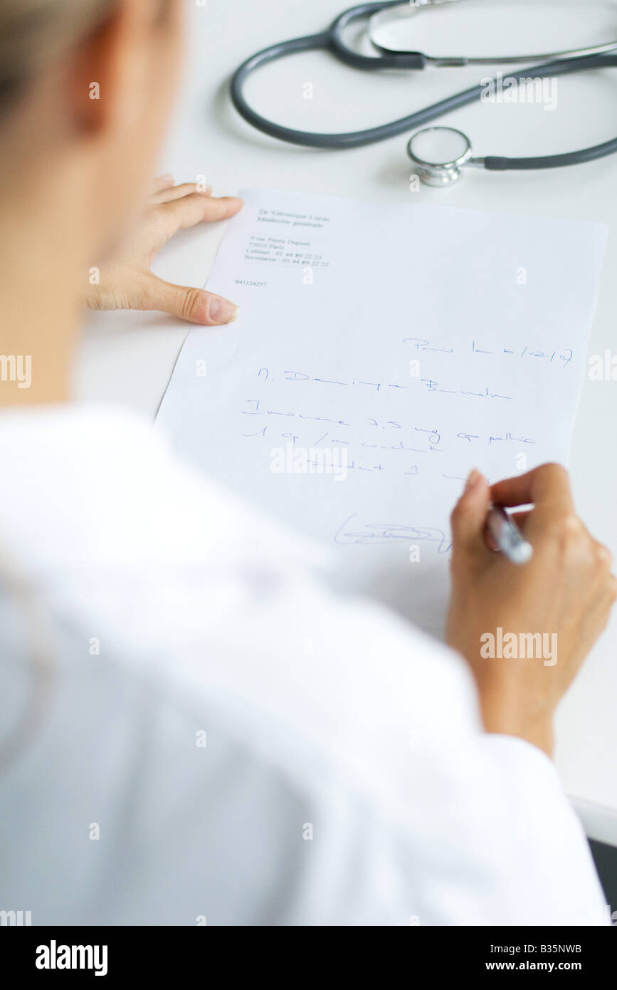 Doctor writing prescription, over the shoulder view, cropped Stock ...