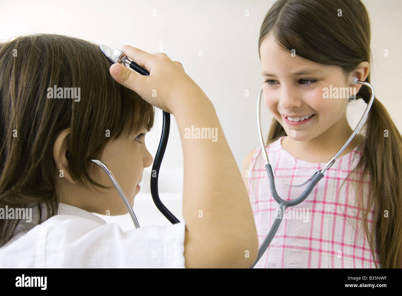 Brother sister playing doctor stethoscope hi-res stock photography and ...