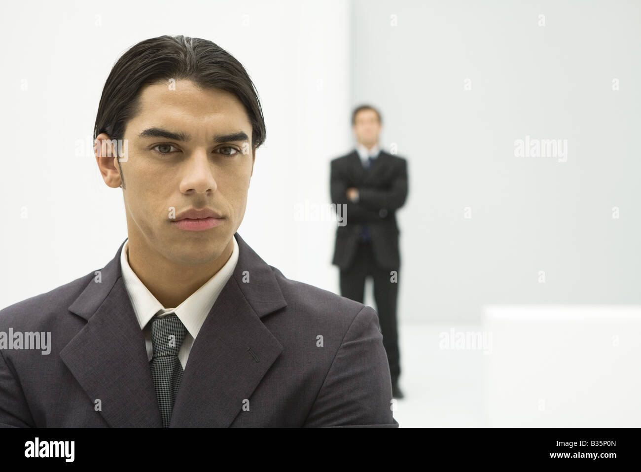 Young businessman looking at camera, portrait, boss standing in ...