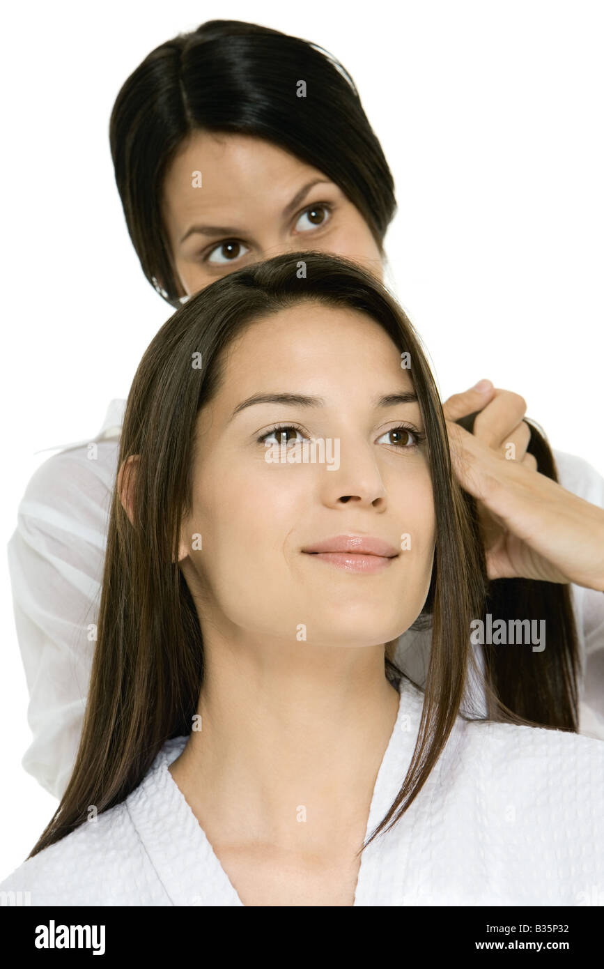 Hairdresser holds strand long hi-res stock photography and images - Alamy