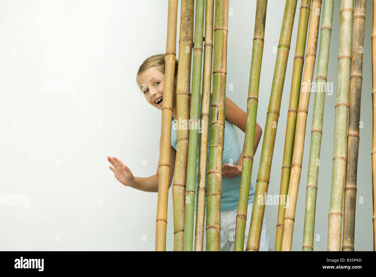 Child hiding behind pole hi-res stock photography and images - Alamy