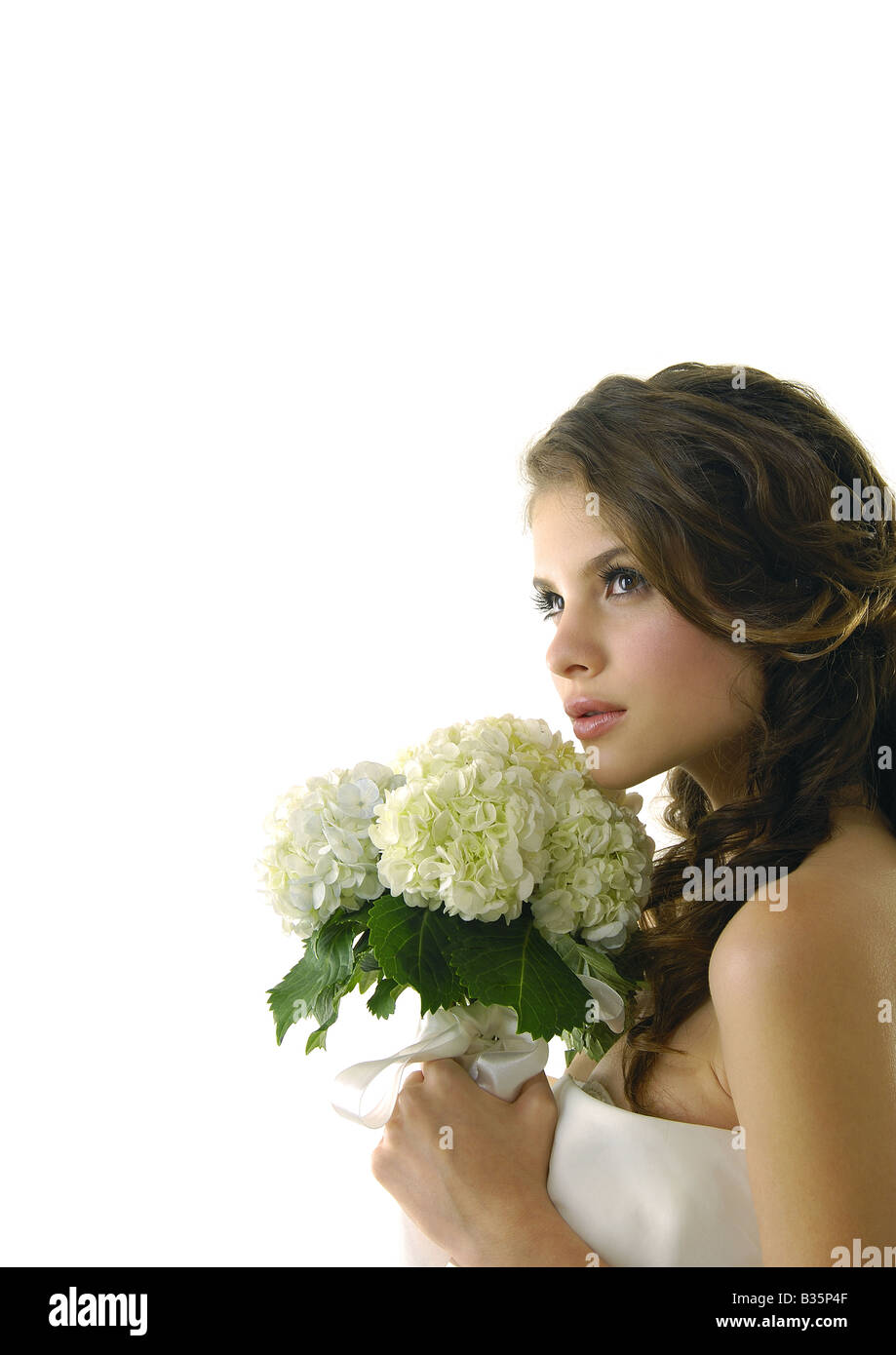 Side profile bride holding bouquet hi-res stock photography and images ...