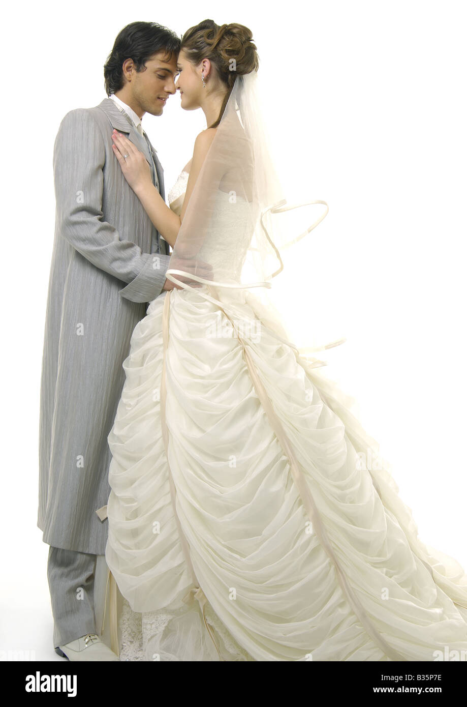 Side profile of a newlywed couple looking at each other Stock Photo - Alamy