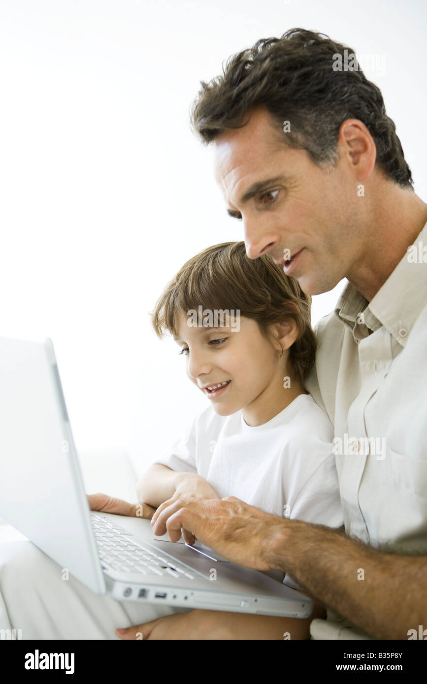 Father son using computers hi-res stock photography and images - Alamy