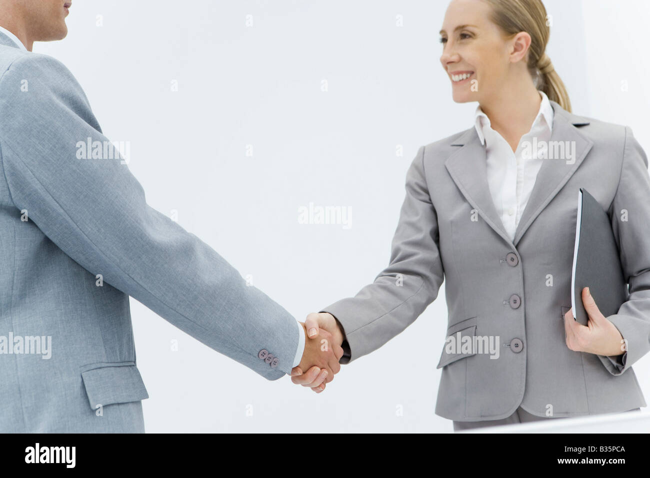 Man sideview handshake hi-res stock photography and images - Alamy