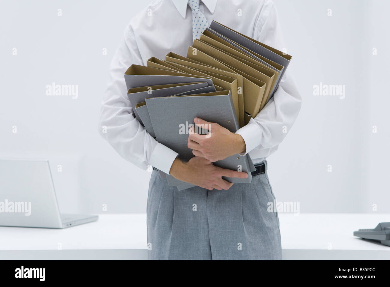 Man holding many binders, cropped view Stock Photo - Alamy