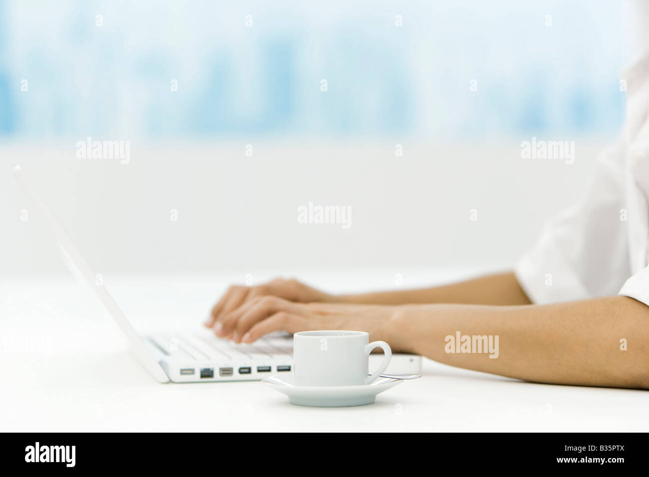 Woman typing computer sideview hi-res stock photography and images - Alamy