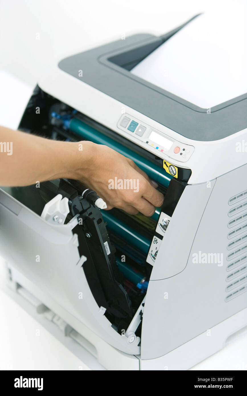 Person fixing paper jam in printer, cropped view Stock Photo - Alamy