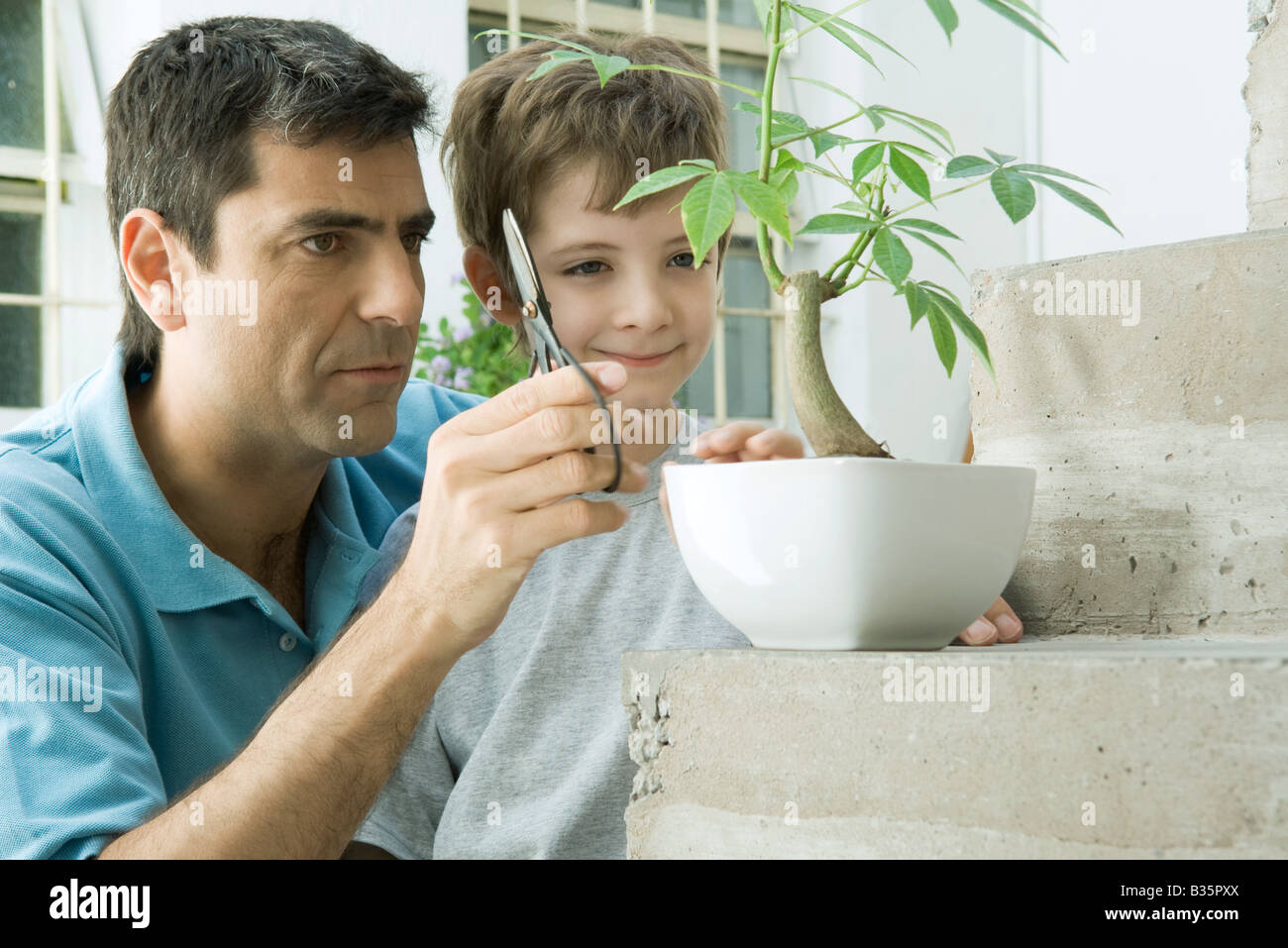 Father teach son plant hi-res stock photography and images - Alamy