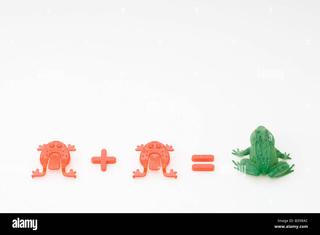 Red frog plus red frog equals green toad Stock Photo - Alamy