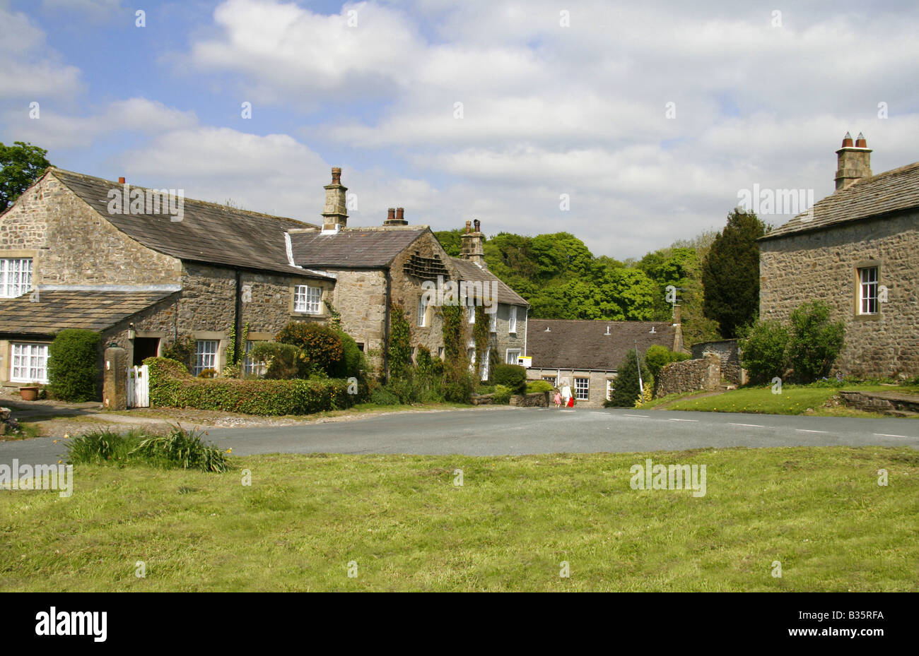 Village green and typical Yorkshire limestone cottages in the village ...