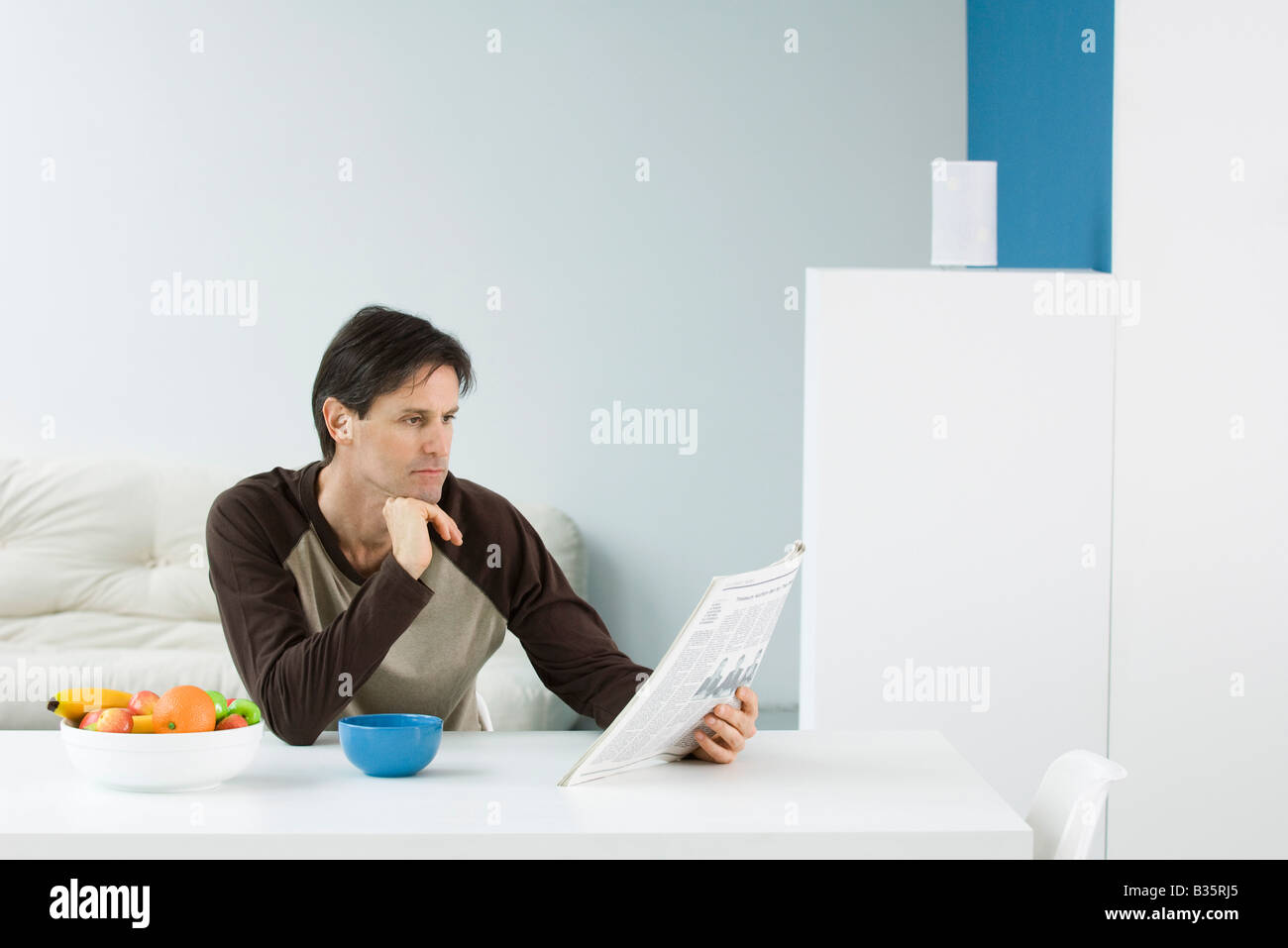 Man looking under table on hi-res stock photography and images - Alamy