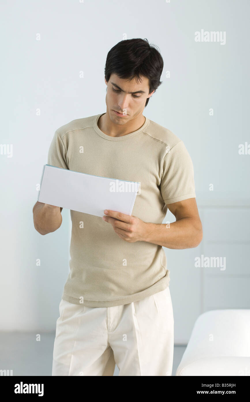 Serious man standing hand hi-res stock photography and images - Alamy